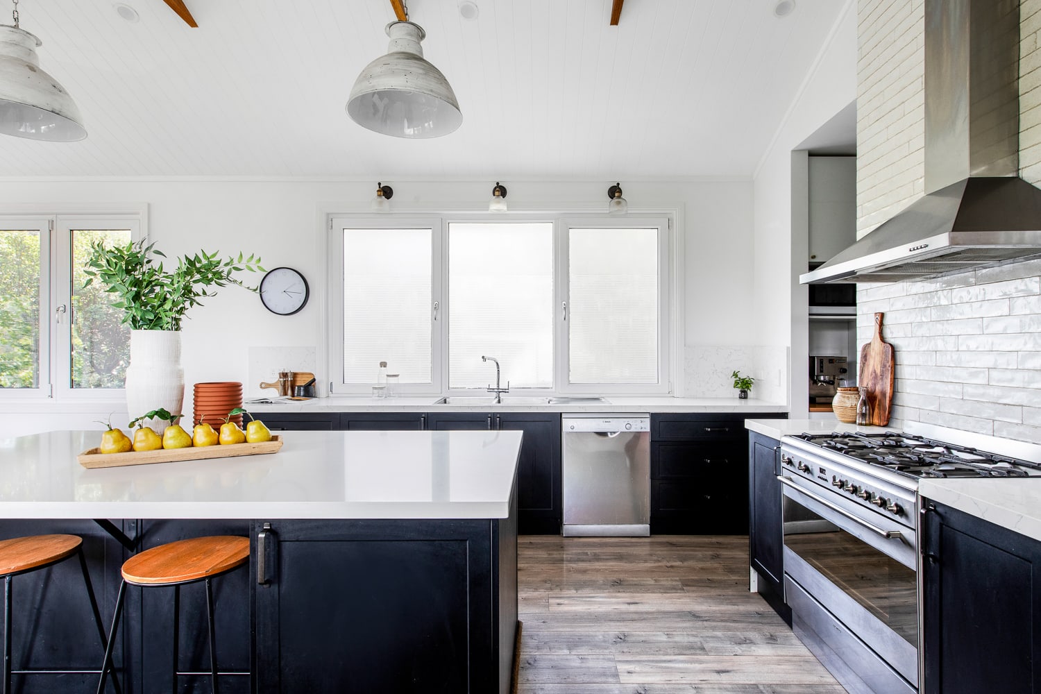 Shingles star in modern farmhouse's moody exterior - The Interiors Addict